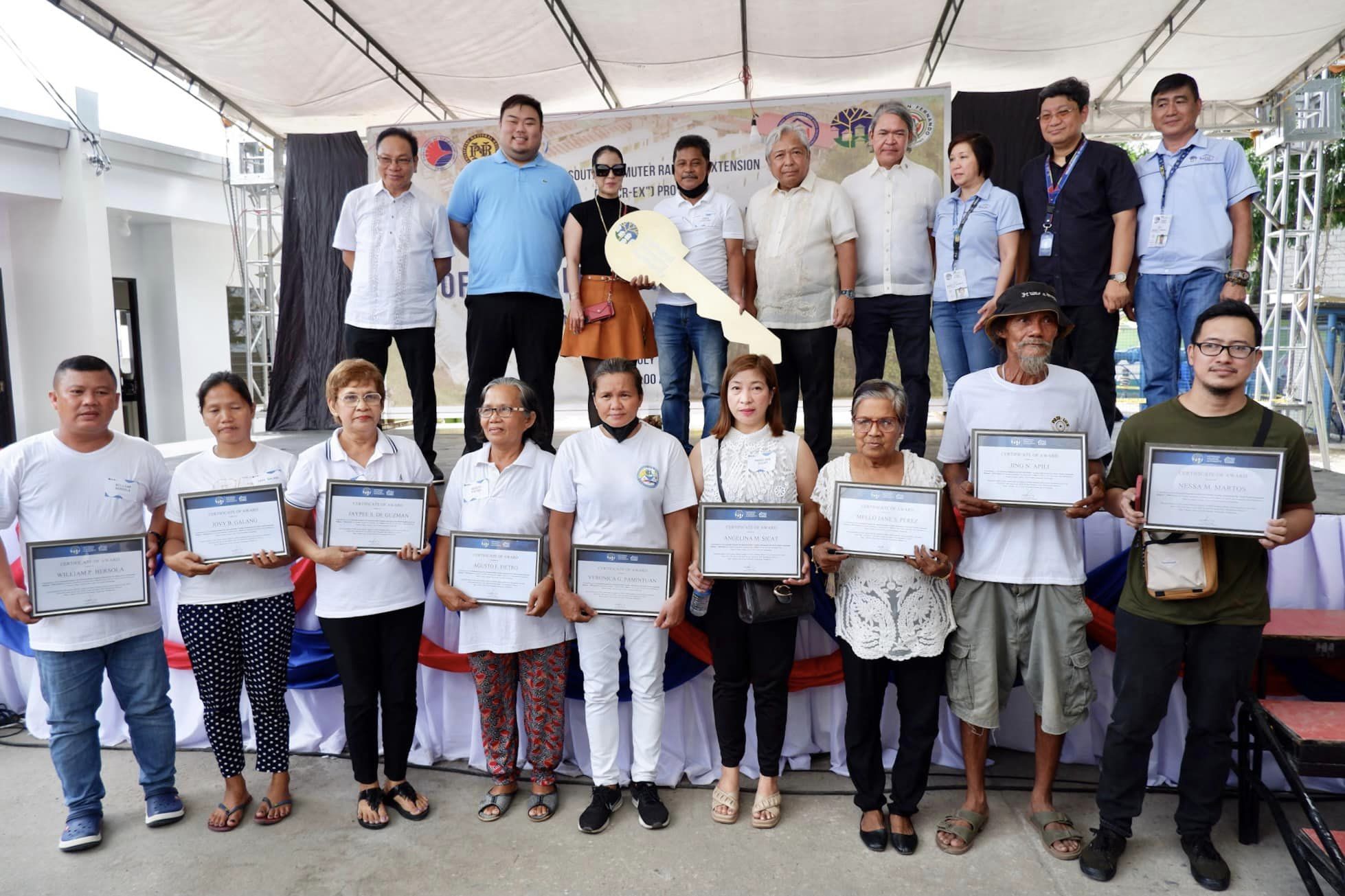 DOTr turns over 50 social housing units to families affected by NSCR ...