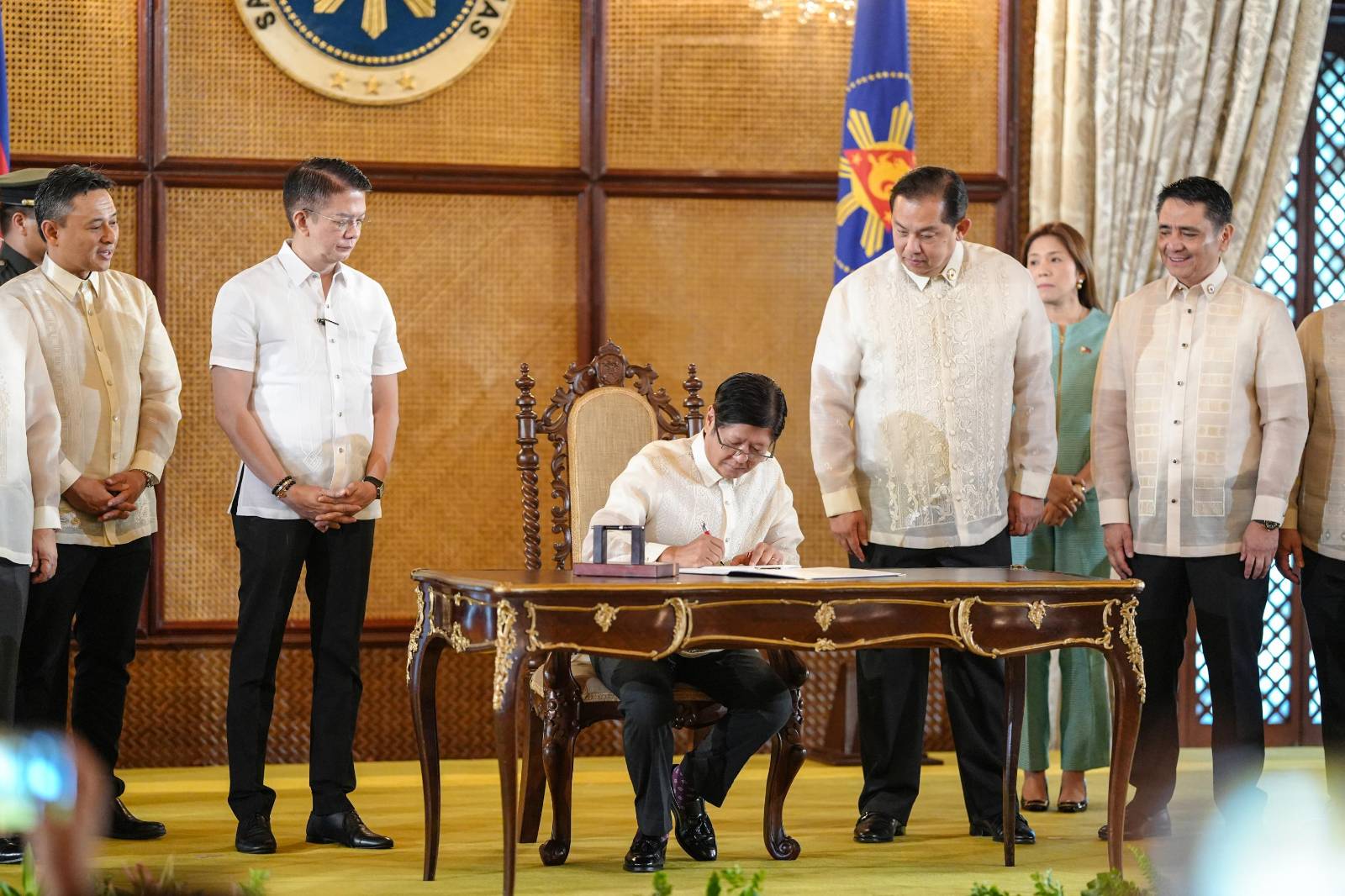 Marcos signs new government procurement, anti-online scam laws ahead of ...